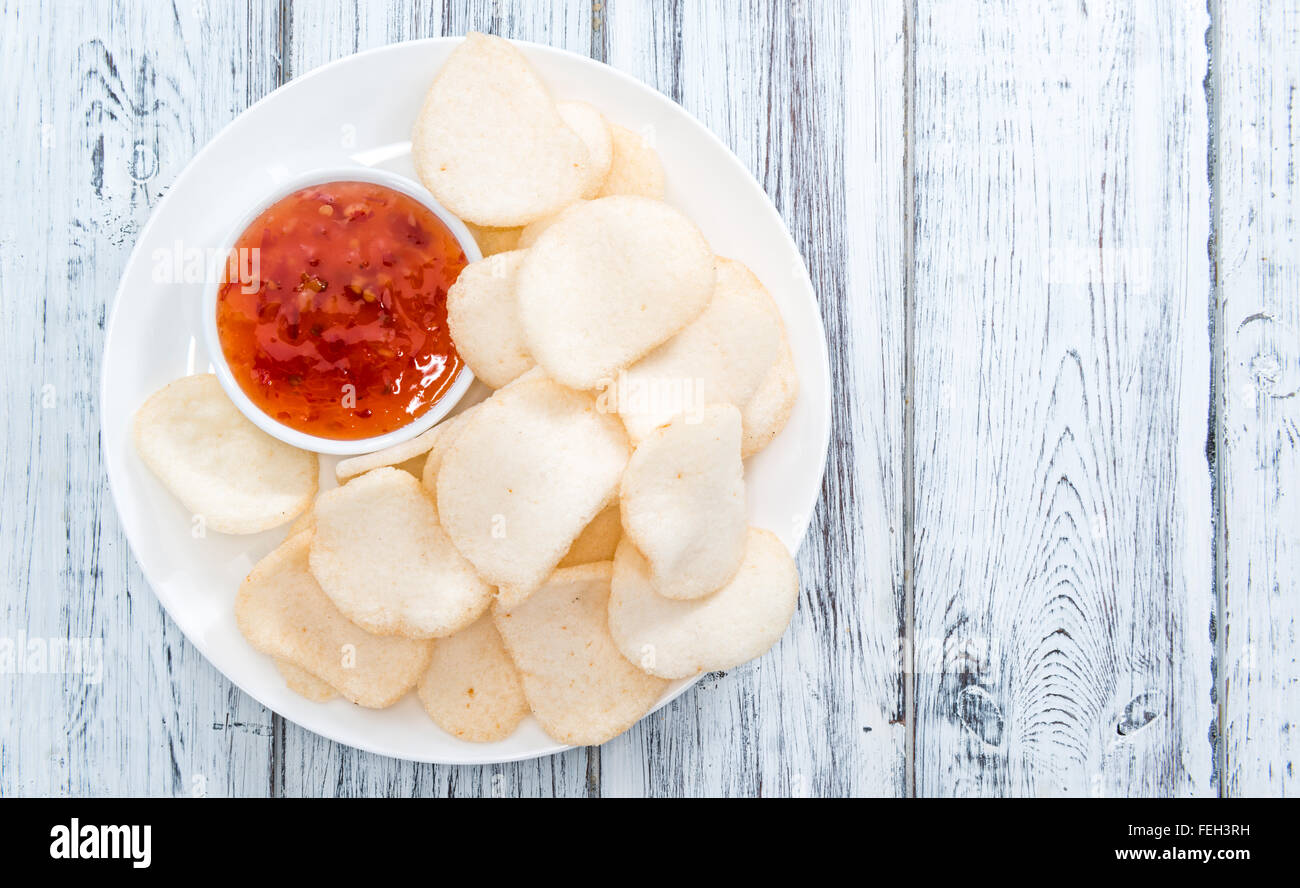 Fresh made Prawn Crackers (Krupuk) on wooden background Stock Photo - Alamy