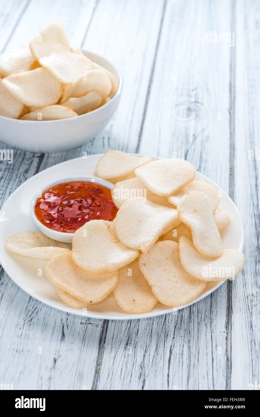 Fresh made Prawn Crackers (Krupuk) on wooden background Stock Photo - Alamy