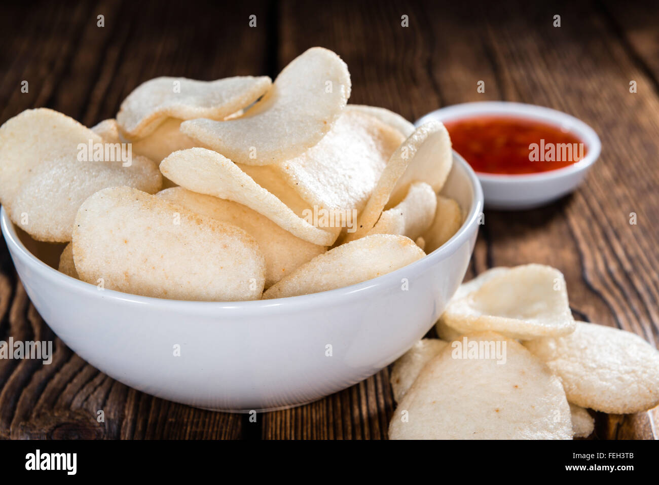Fresh made Prawn Crackers (Krupuk) on wooden background Stock Photo - Alamy