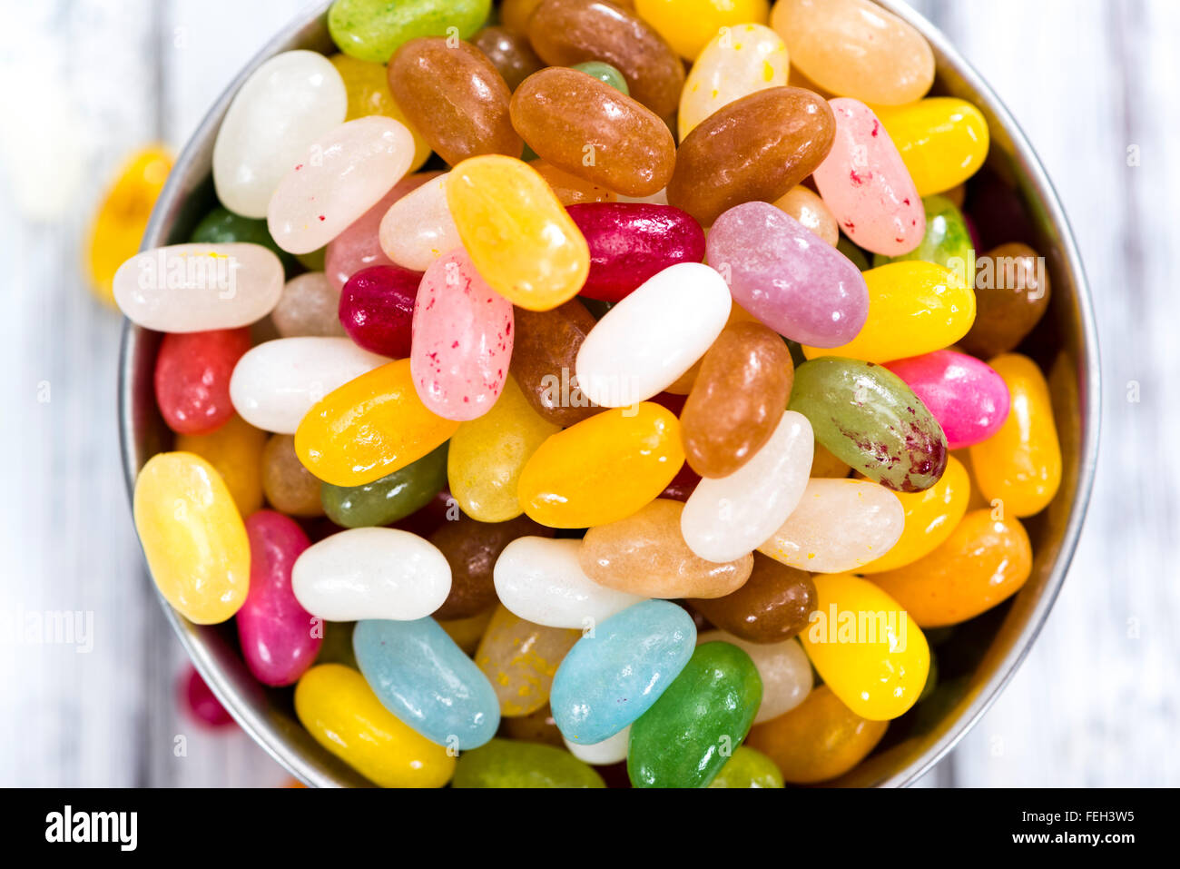 Colorfull Jelly Beans (close-up shot) on bright wooden background Stock ...