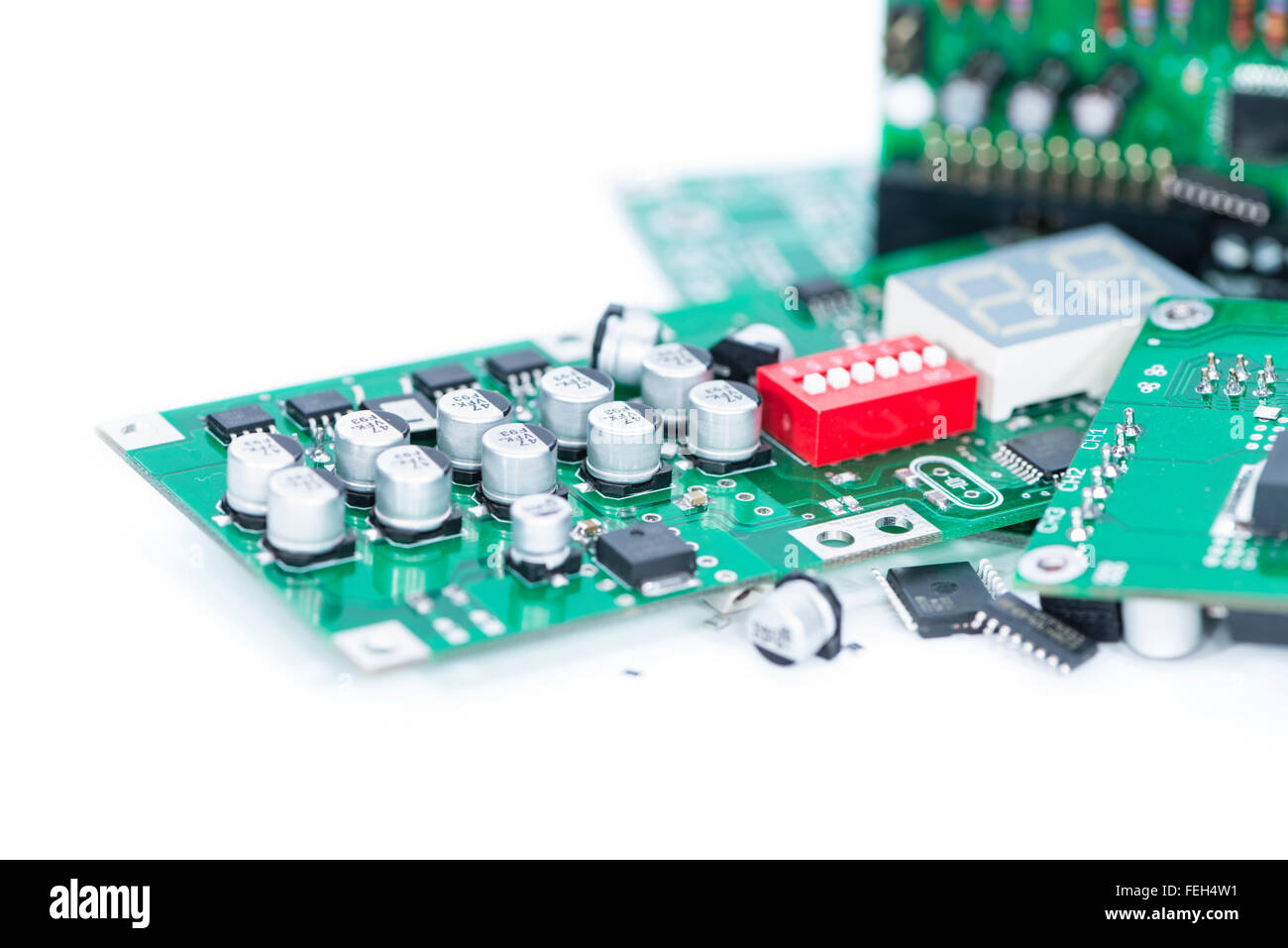 Heap of PCBs and electronic components isolated on white background ...