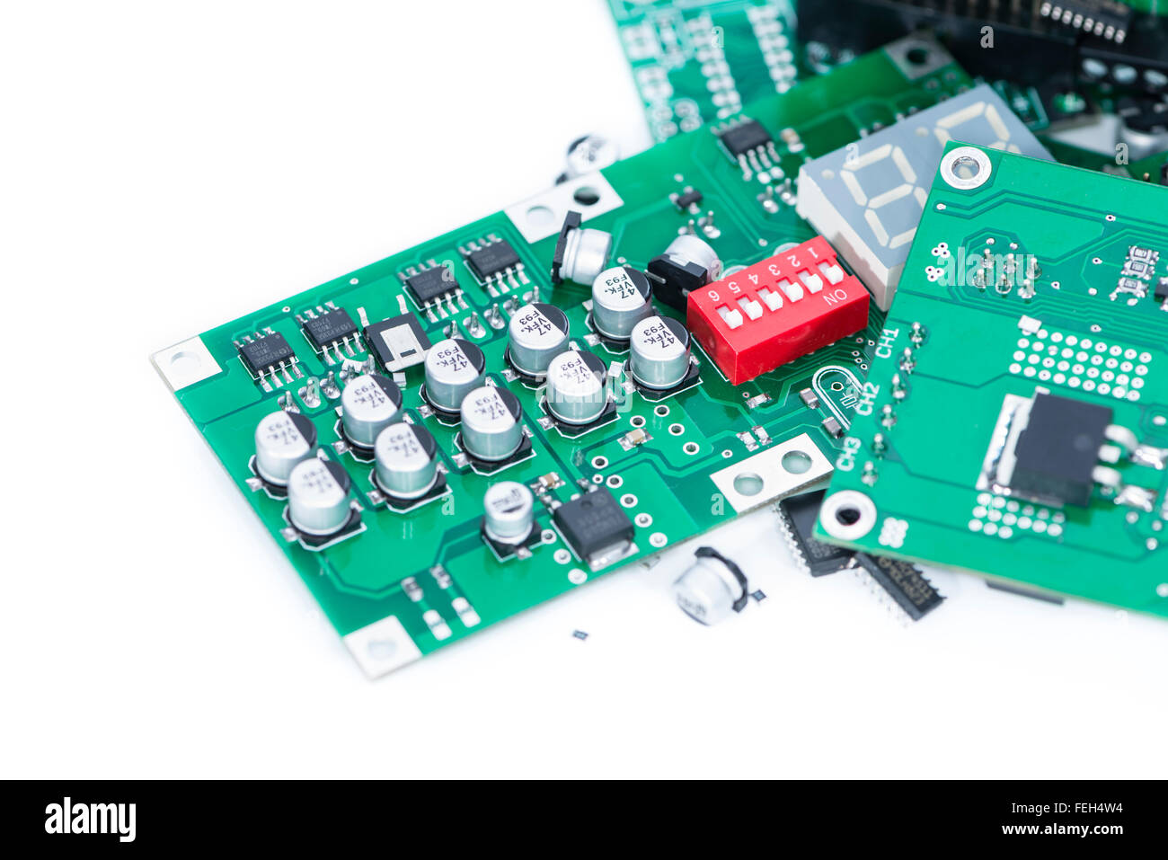 Heap of PCBs and electronic components isolated on white background ...