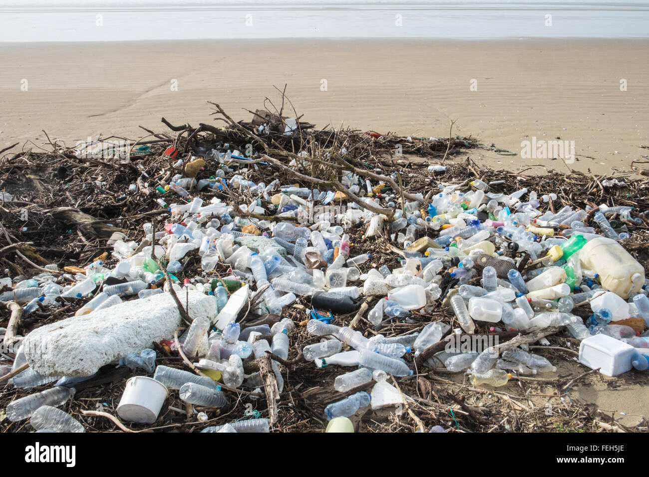 Plastic containers washed up on beach hi-res stock photography and ...