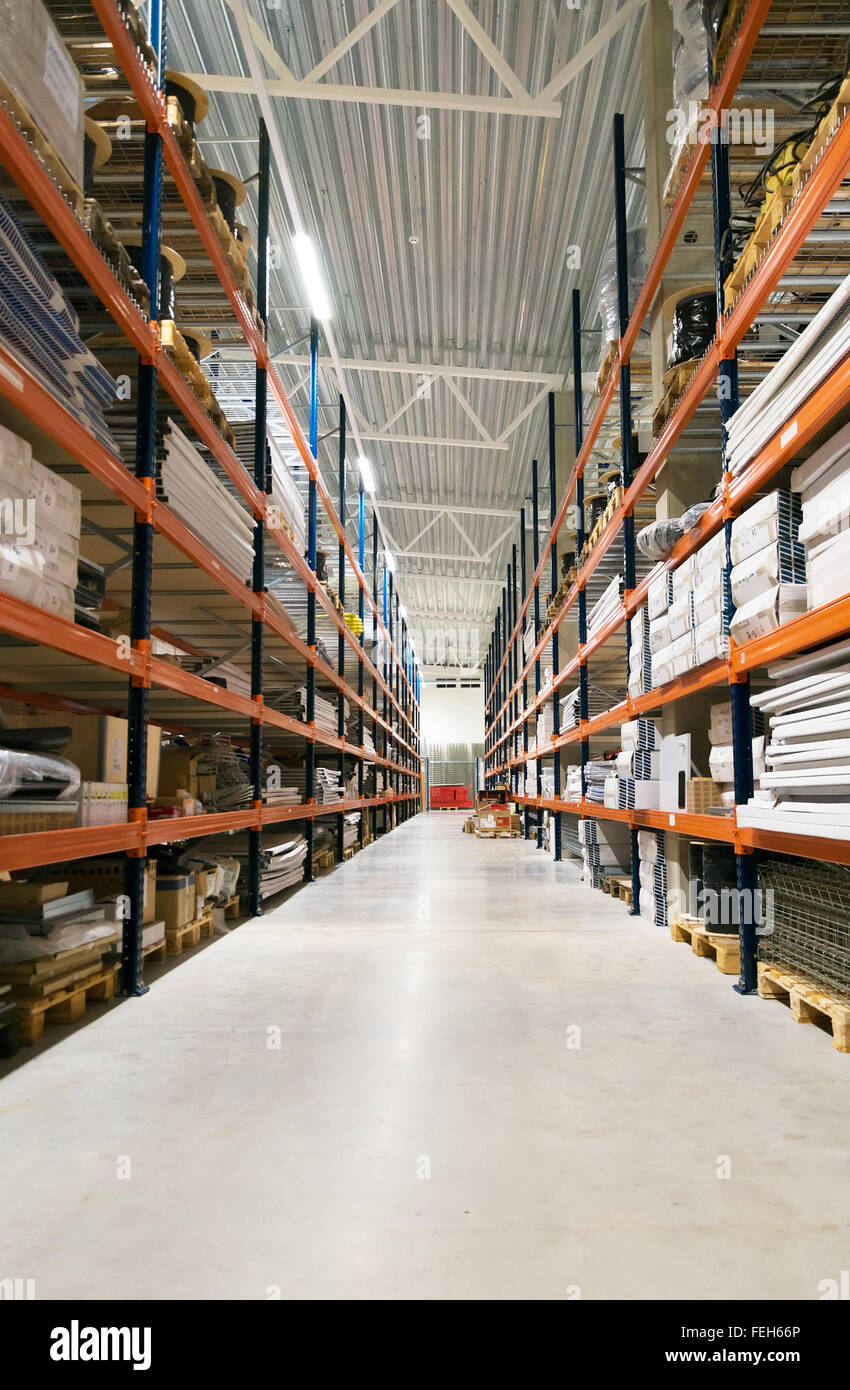 Warehouse storage racks with boxes and goods Stock Photo - Alamy