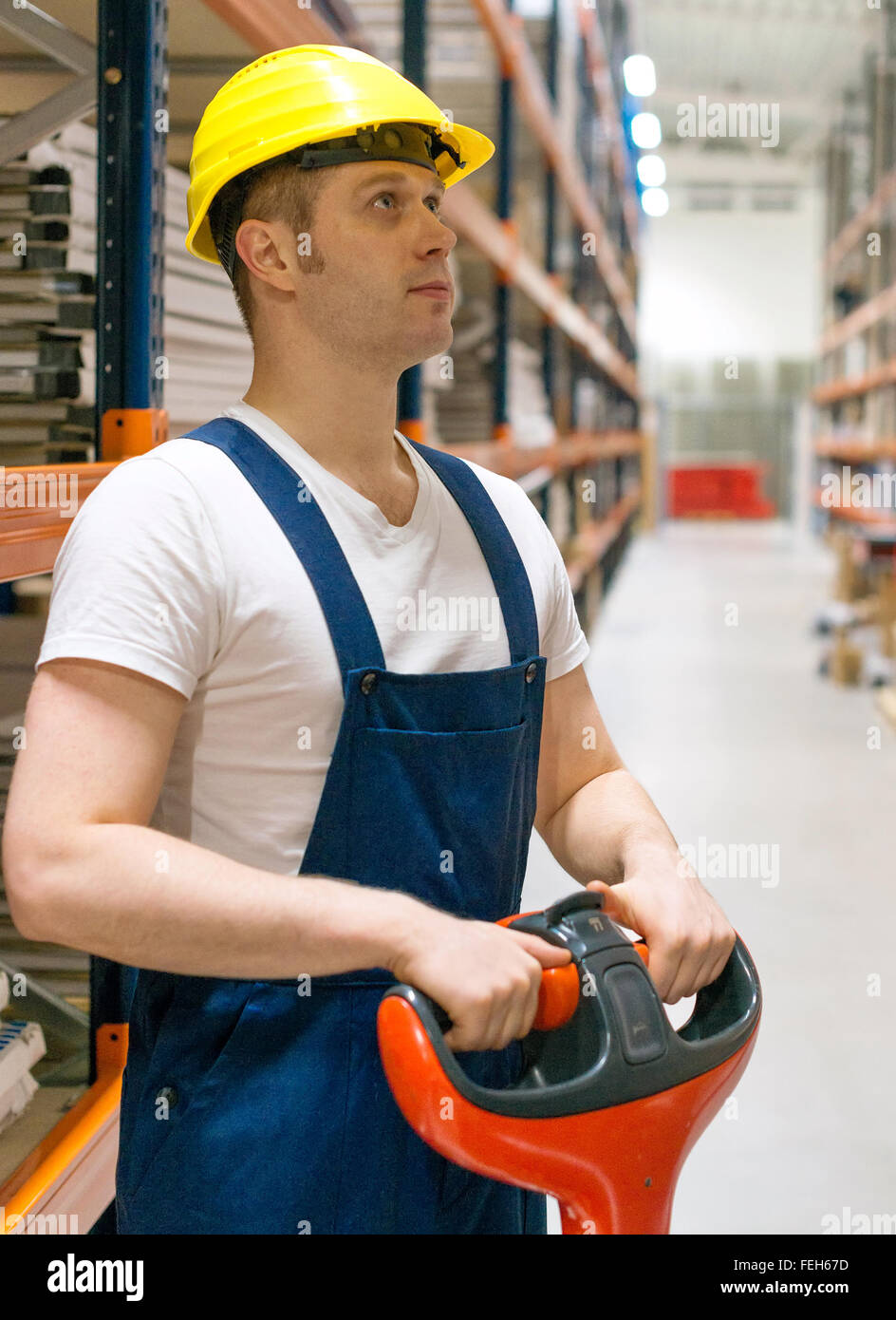 Forklift operator working in the warehouse Stock Photo - Alamy