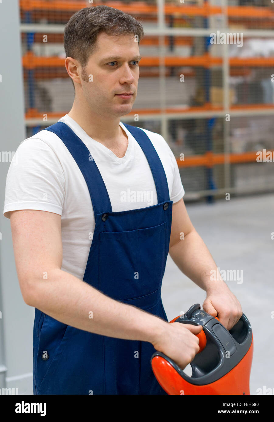 Forklift operator working in the warehouse Stock Photo - Alamy