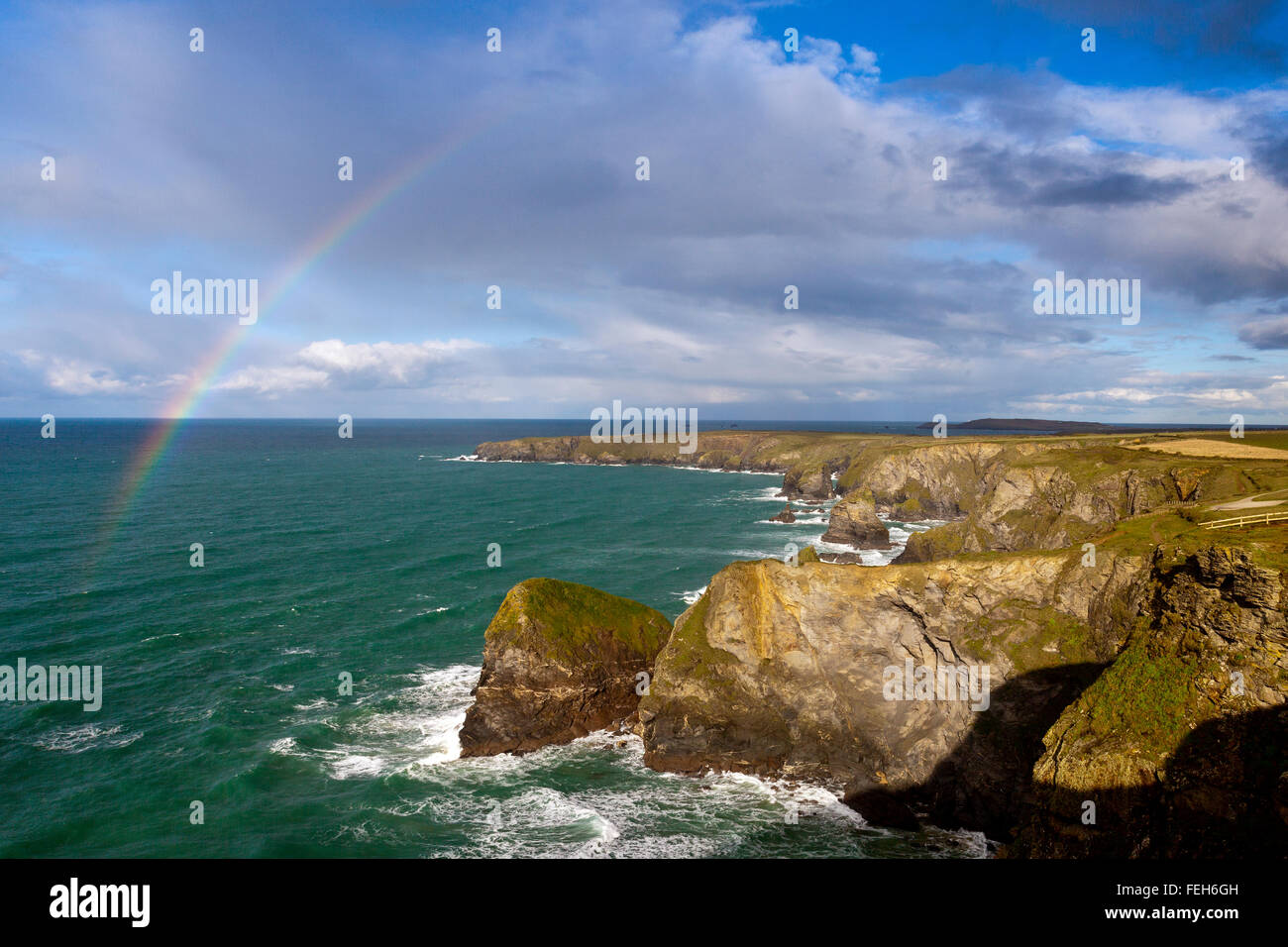 A rainbow over the dramatic sea stacks at Bedruthan Steps on the north ...