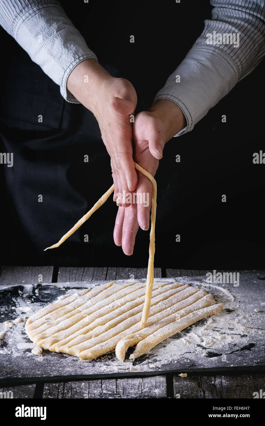 Making pasta by female hands Stock Photo - Alamy