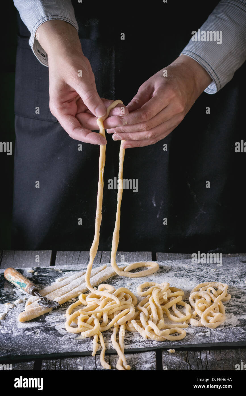 Making pasta by female hands Stock Photo - Alamy