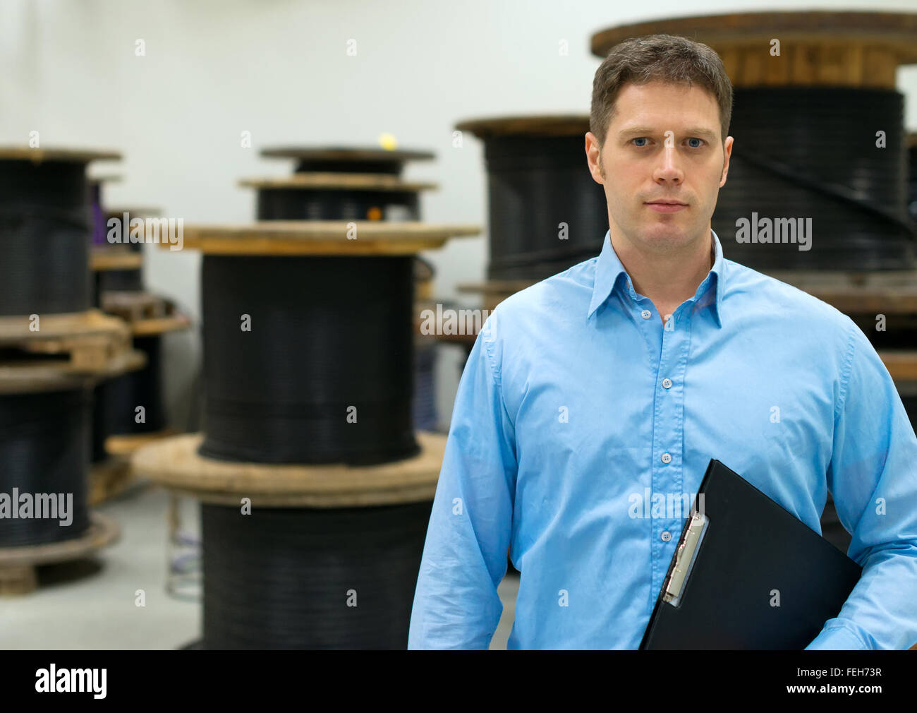 Handsome manager at electrical wire and cable factory Stock Photo - Alamy