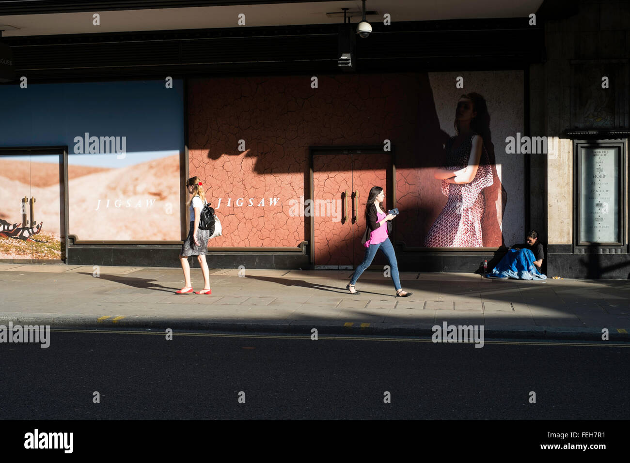 sidewalk pavement pedestrians shops London Stock Photo - Alamy