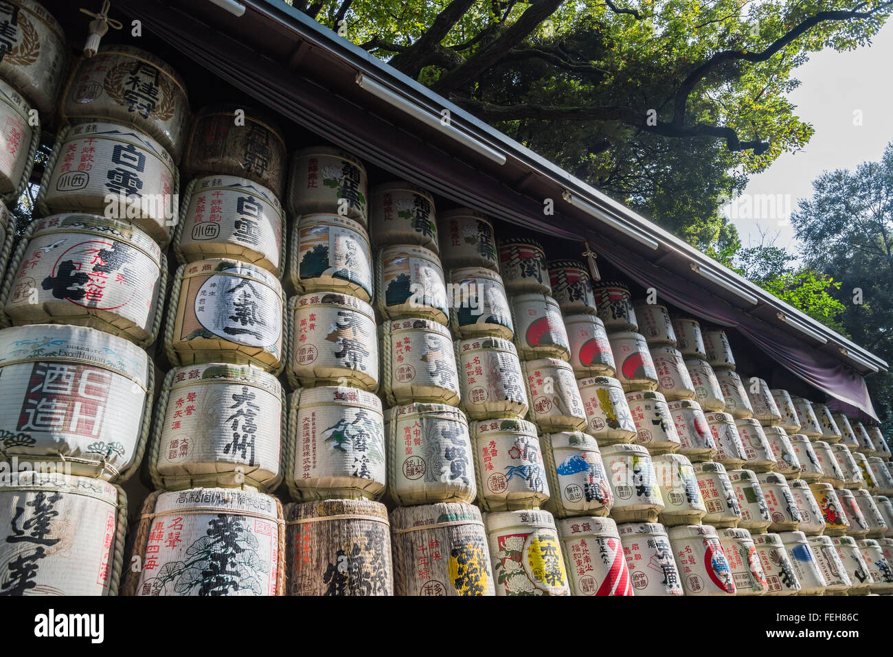 Japanese Barrels of Sake wrapped in Straw stacked on shelf Stock Photo ...