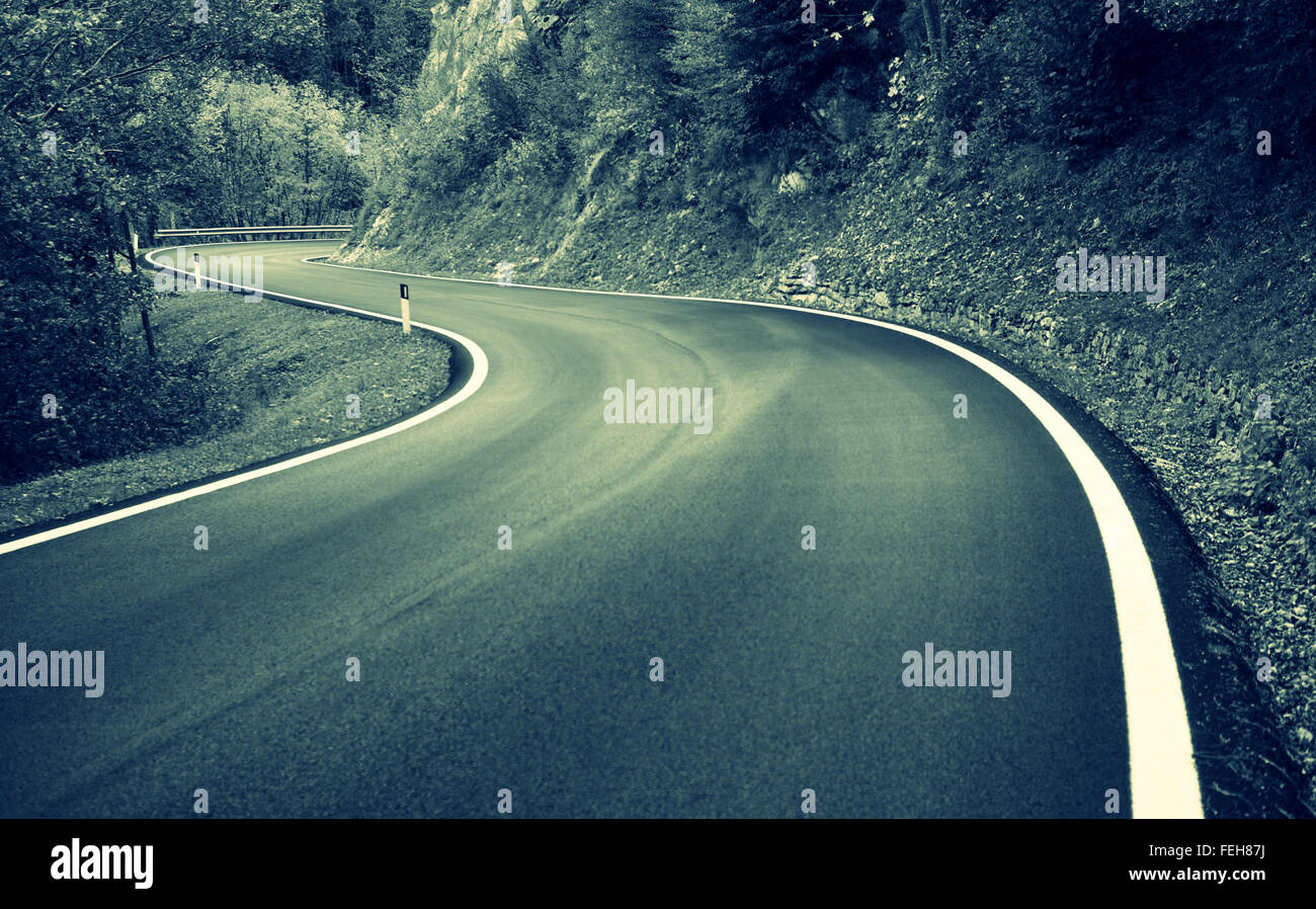 Empty road through the mountains Stock Photo - Alamy