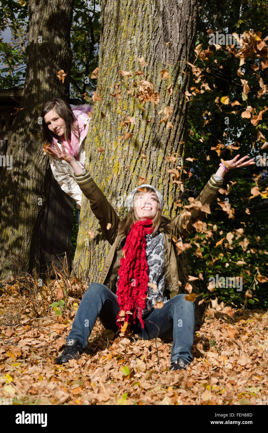 Two girl in autumn Stock Photo - Alamy