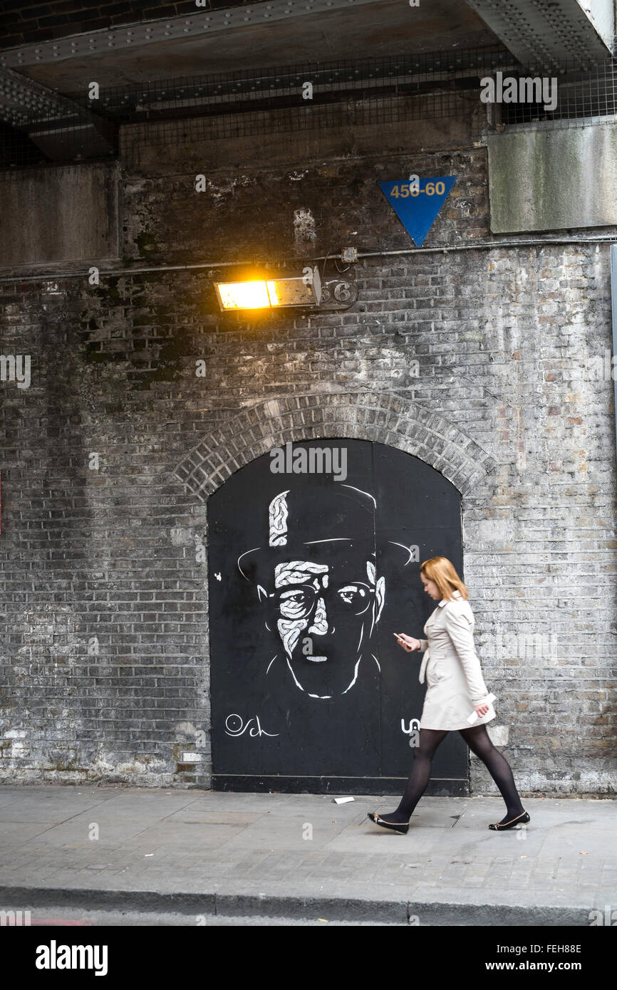 sidewalk woman walking alone pavement London Stock Photo - Alamy