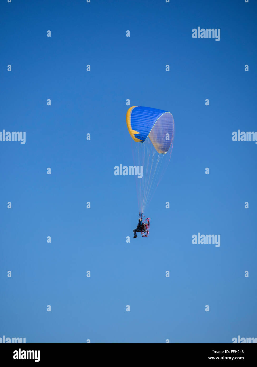 A man flies in his paramotor ultralight in the air by the Salton Sea ...