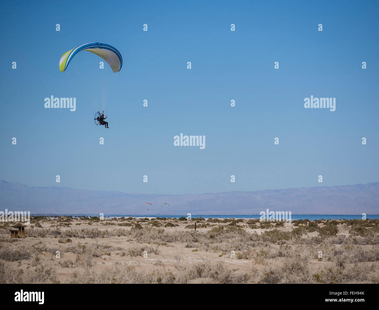 A man flies in his paramotor ultralight in the air by the Salton Sea ...