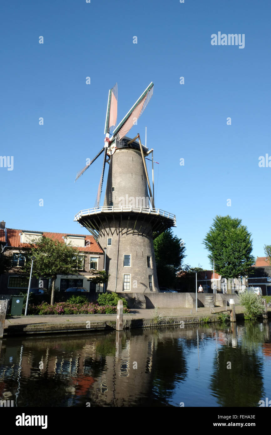 Windmill at river port, Gouda, South Holland, The Netherlands Stock ...