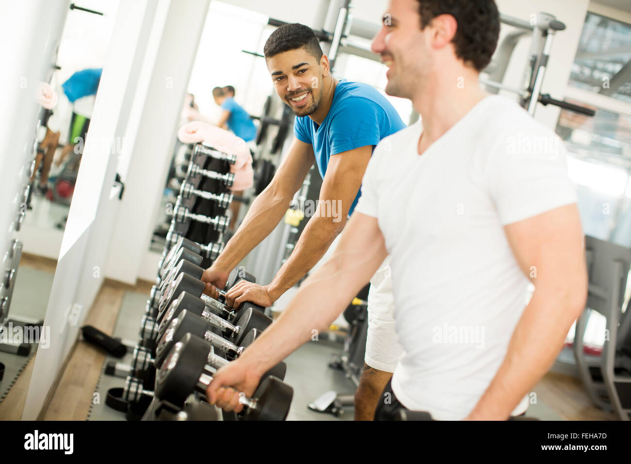 Young men training in the gym Stock Photo - Alamy