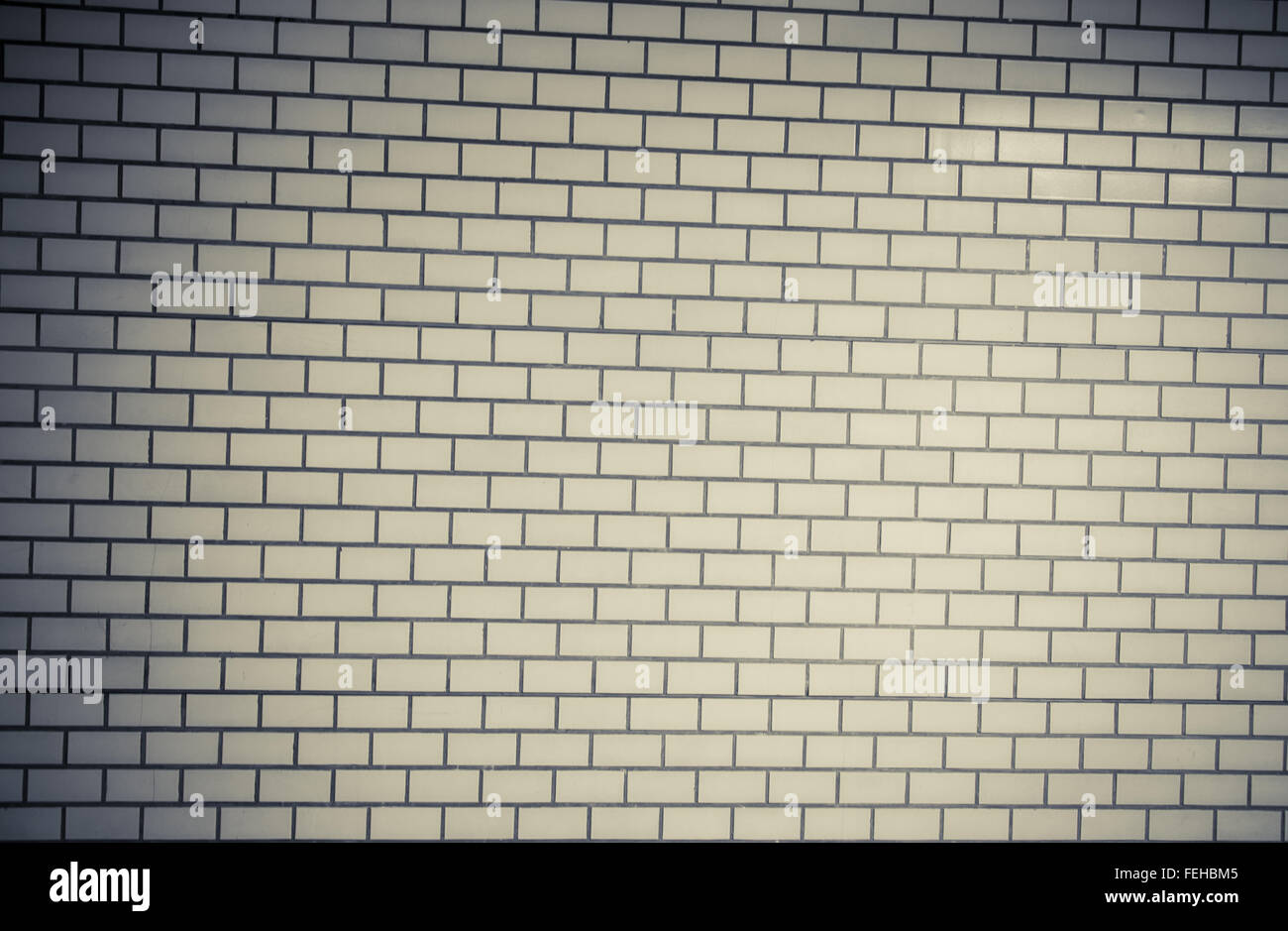 Block wall pattern in vintage style with under exposure Stock Photo - Alamy