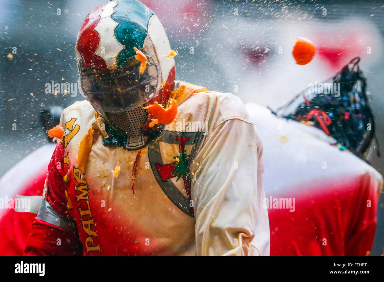 Ivrea, Italy. 07th Feb, 2016. Orange throwers on horse-drawn carts hit ...