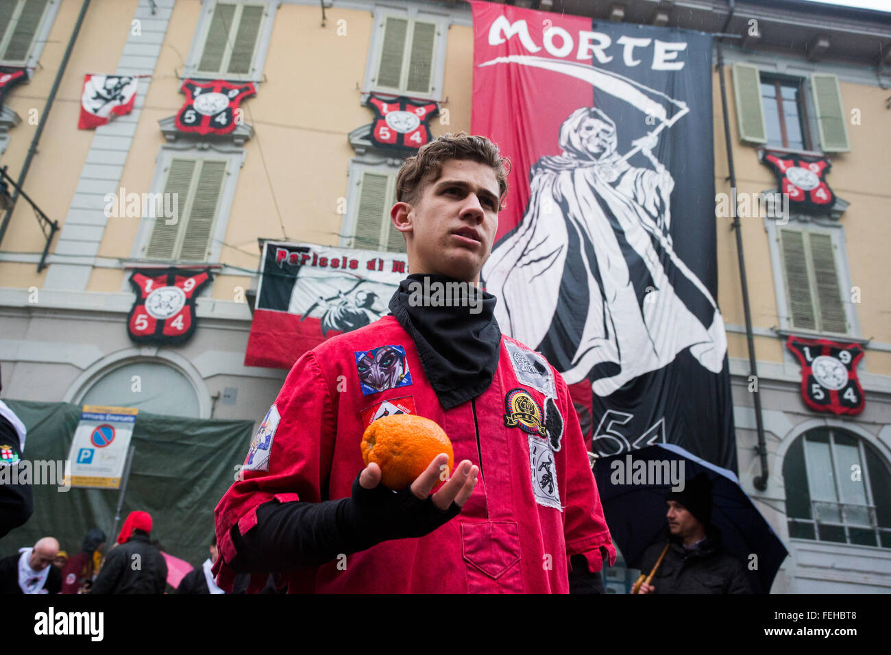 Ivrea, Italy. 07th Feb, 2016. Orange throwers on foot waits to throw ...