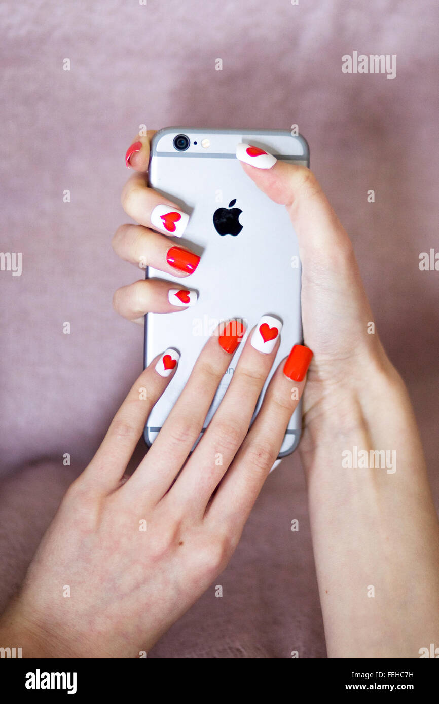 Female hands with painted nails hi-res stock photography and images - Alamy