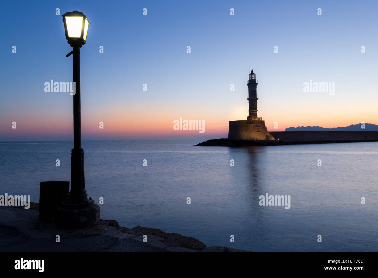 Chania lighthouse at sunrise, harbor, Chania, Crete, Greece Stock Photo ...