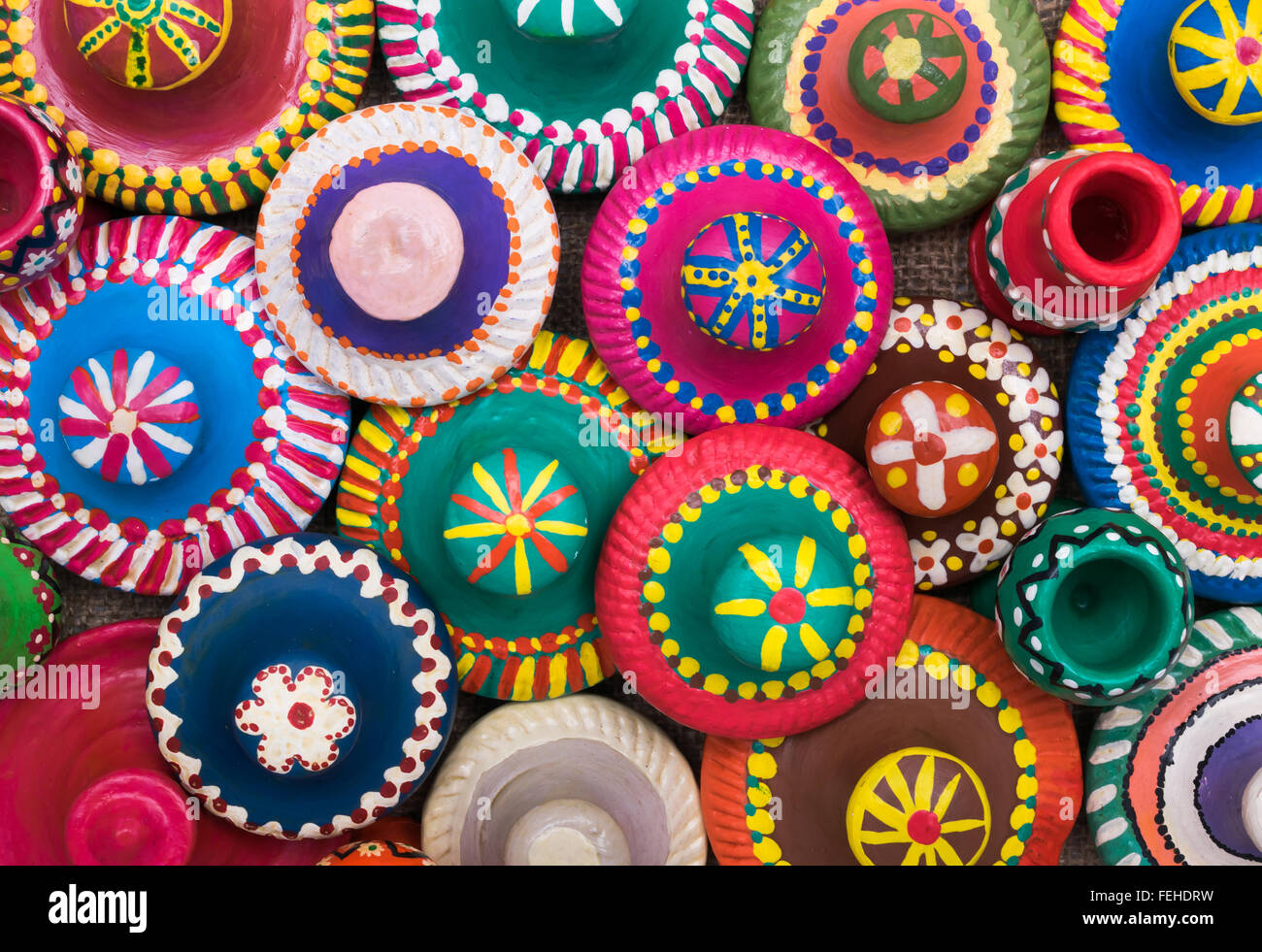 Composition of painted handmade pottery vessels top covers Stock Photo ...