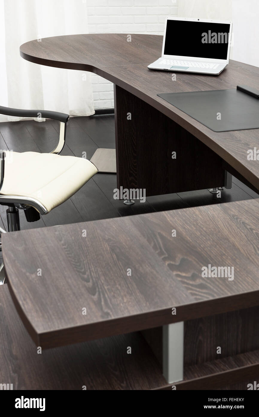 laptop on a desk in a modern office Stock Photo - Alamy