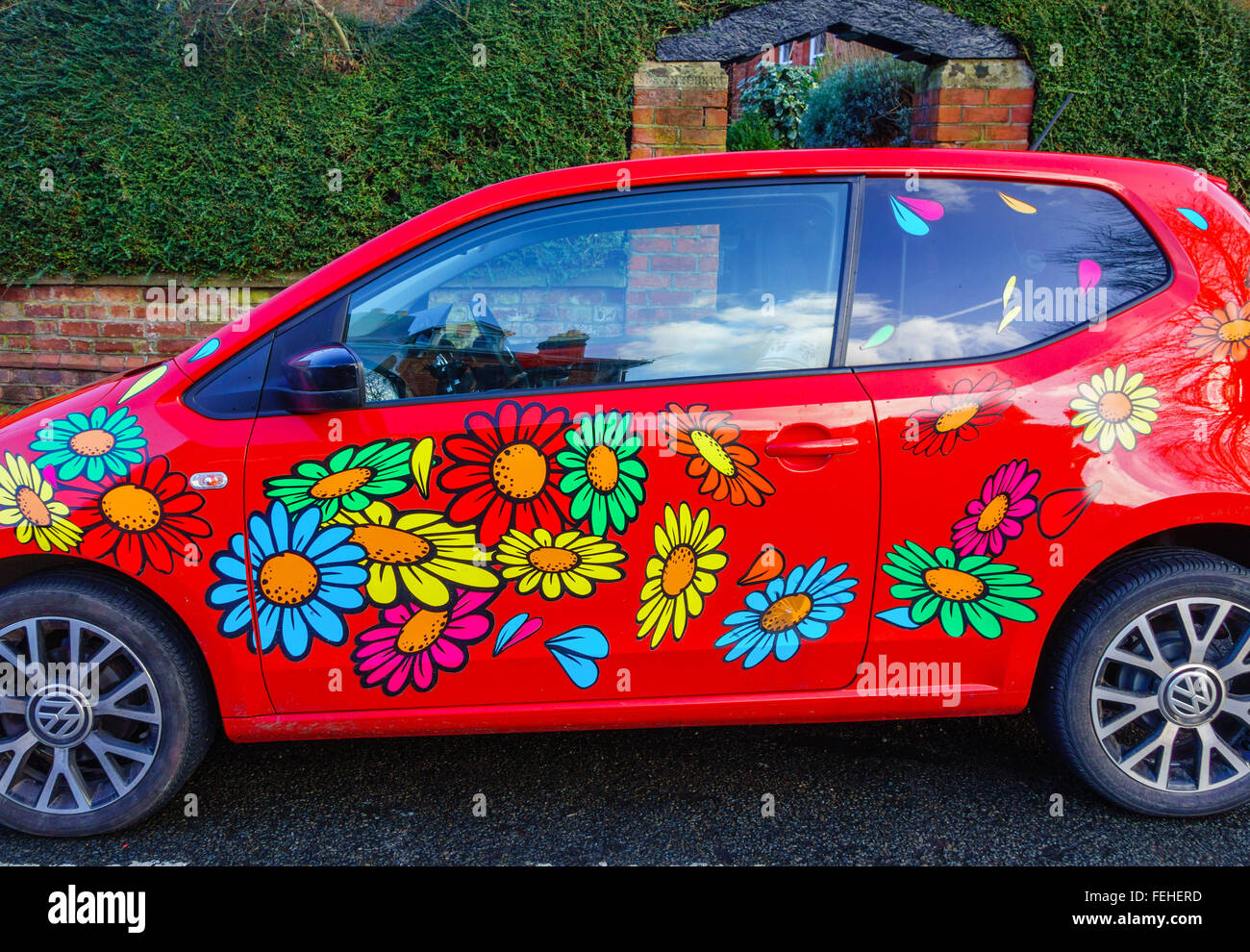 Red VW car adorned with colorful flowers Stock Photo - Alamy