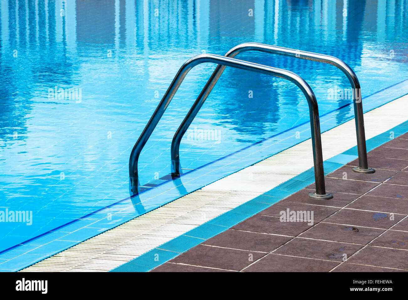 metal railings stairs pool with reflection Stock Photo - Alamy