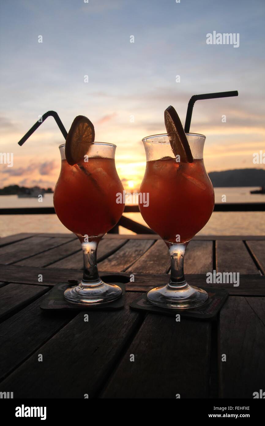 Cocktails at Sunset Stock Photo - Alamy