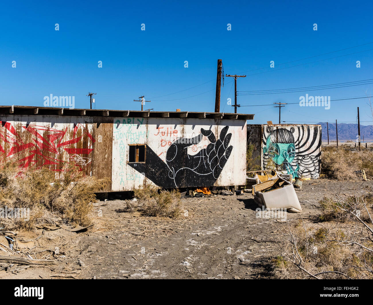 Dilapidated graffiti tagged buildings at Salton Sea Beach with very ...