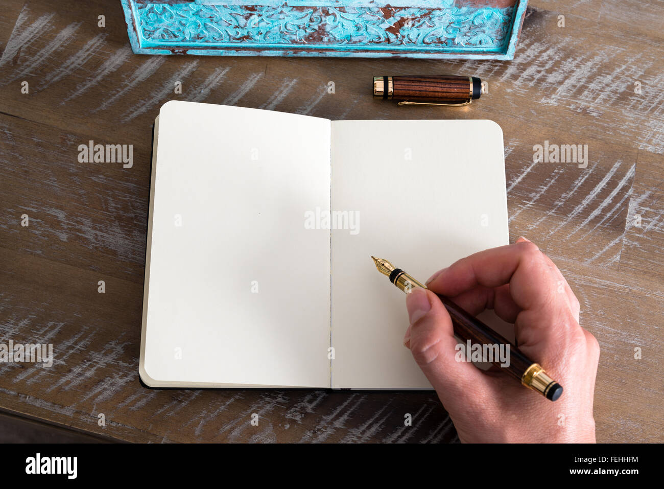 Retro effect and toned image of a woman hand writing a note with a ...