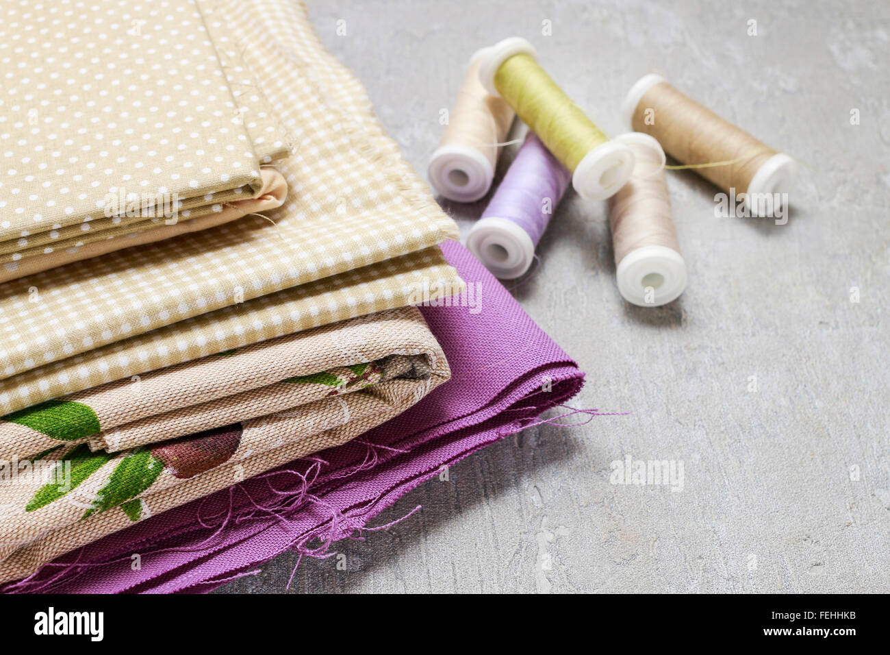 Sewing set: fabrics and threads Stock Photo - Alamy