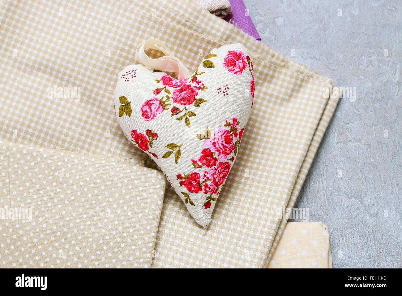 Handmade heart lying on the fabrics Stock Photo - Alamy