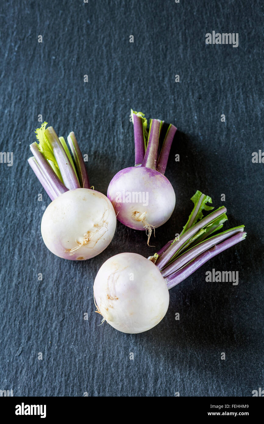 Mini Turnips on a slate background Stock Photo - Alamy