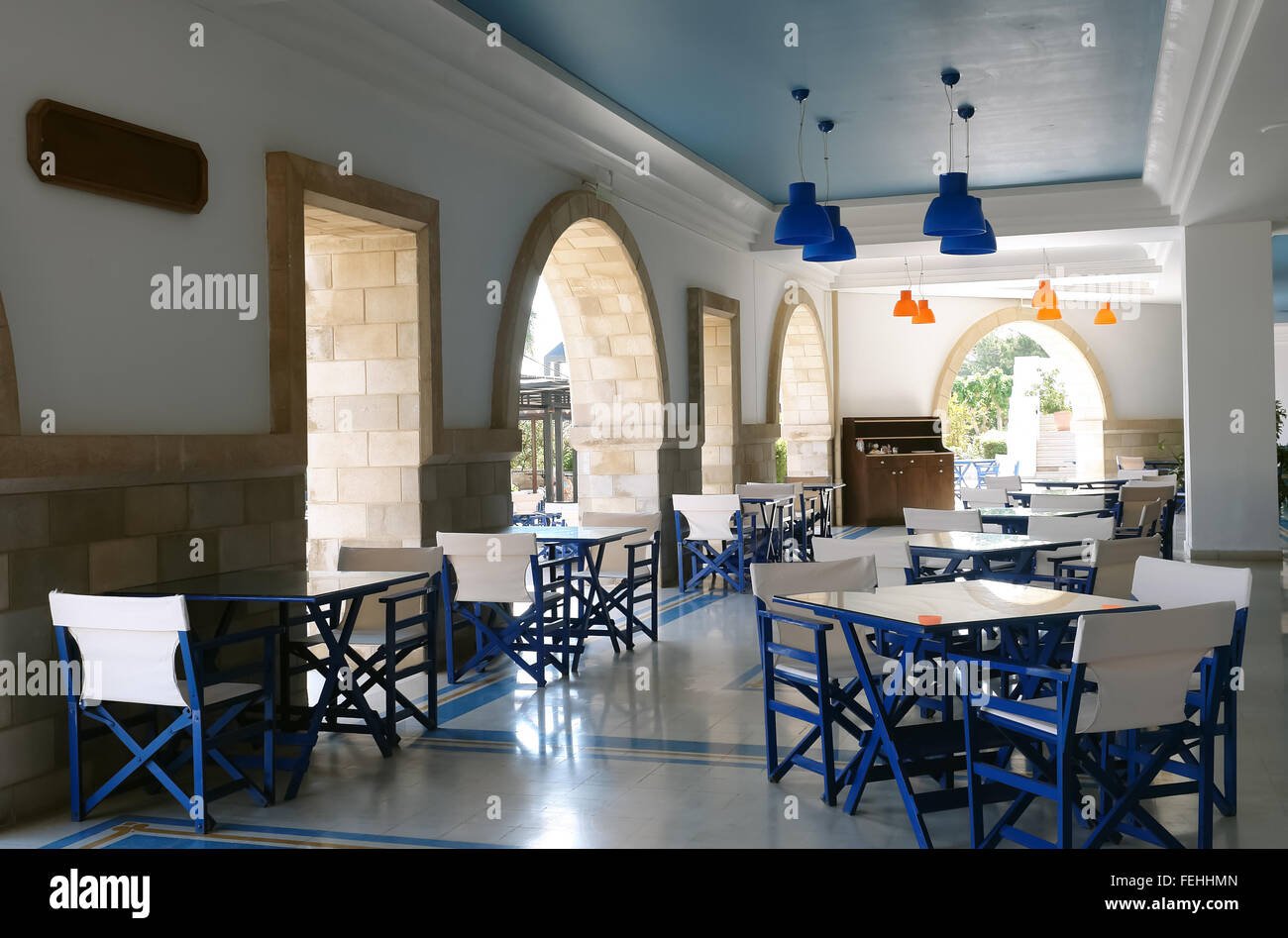 Crete Island, GREECE - MAY 11, 2014: Cafe interior with blue table in ...