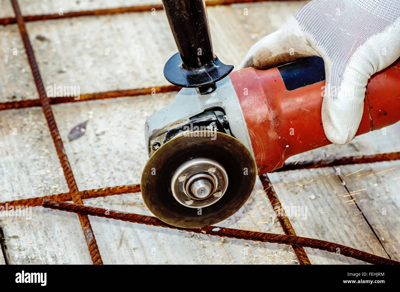 Worker cutting construction steel net with Angle Grinder Machine ...