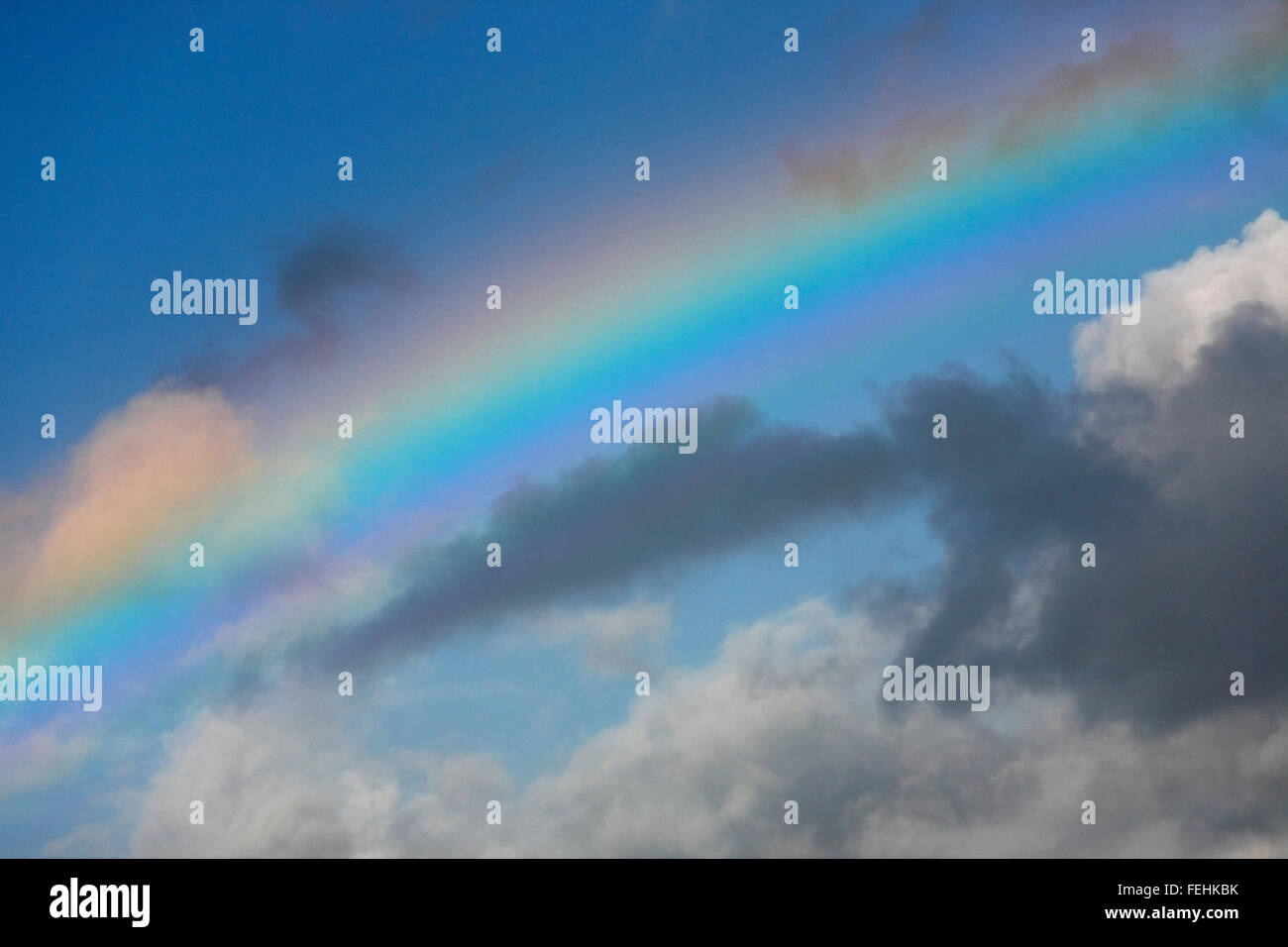 Blue sky with clouds and rainbow hi-res stock photography and images ...