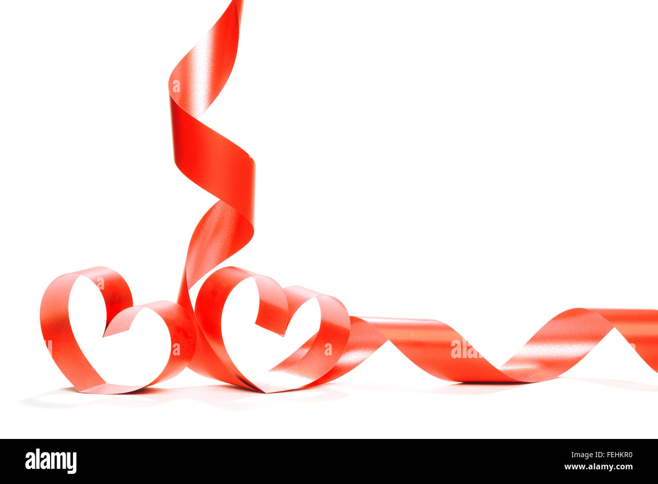 red heart ribbon isolated on white background Stock Photo - Alamy