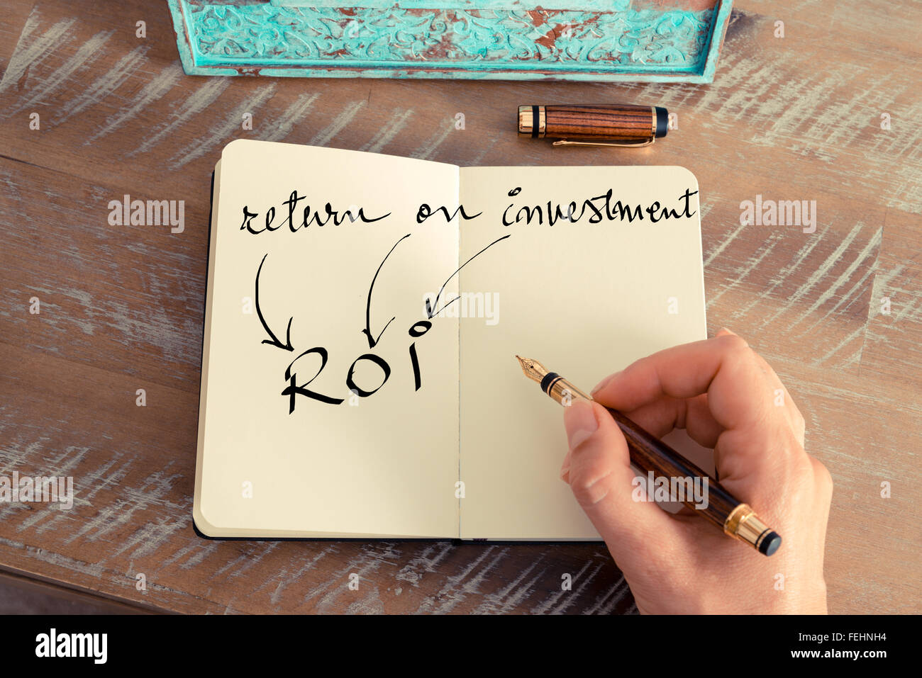 Retro effect and toned image of a woman hand writing a note with a ...