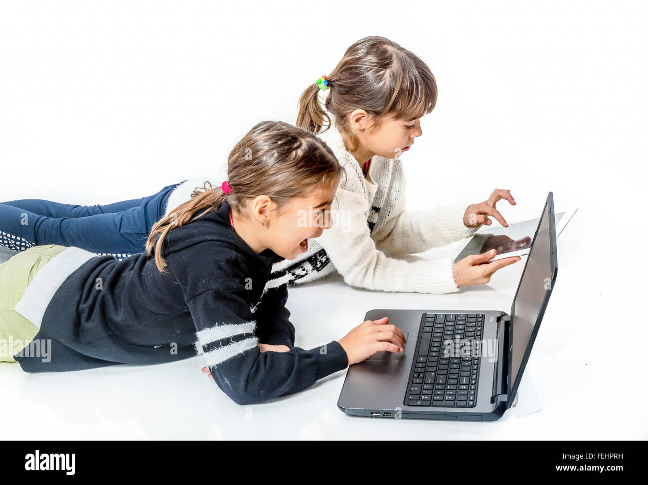 Girls playing on the computer hi-res stock photography and images - Alamy