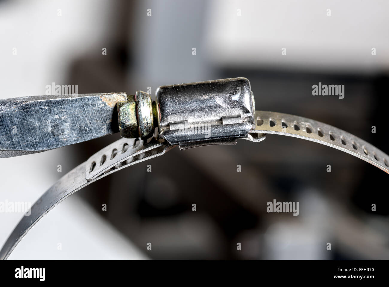Close up of a pipe clamping tightening Stock Photo - Alamy