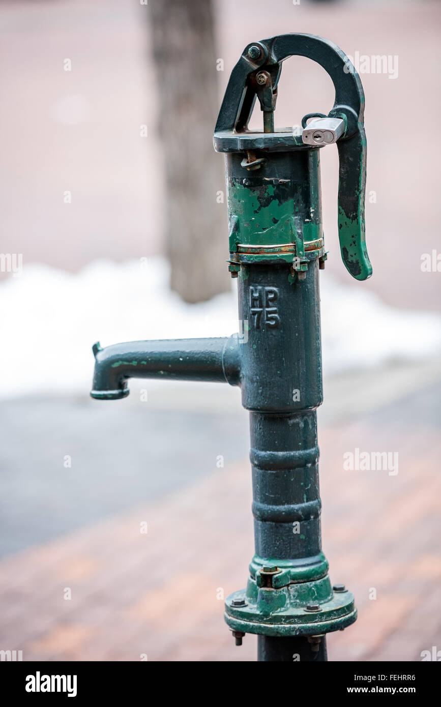 Water pump hydrant with a lock on it Stock Photo - Alamy