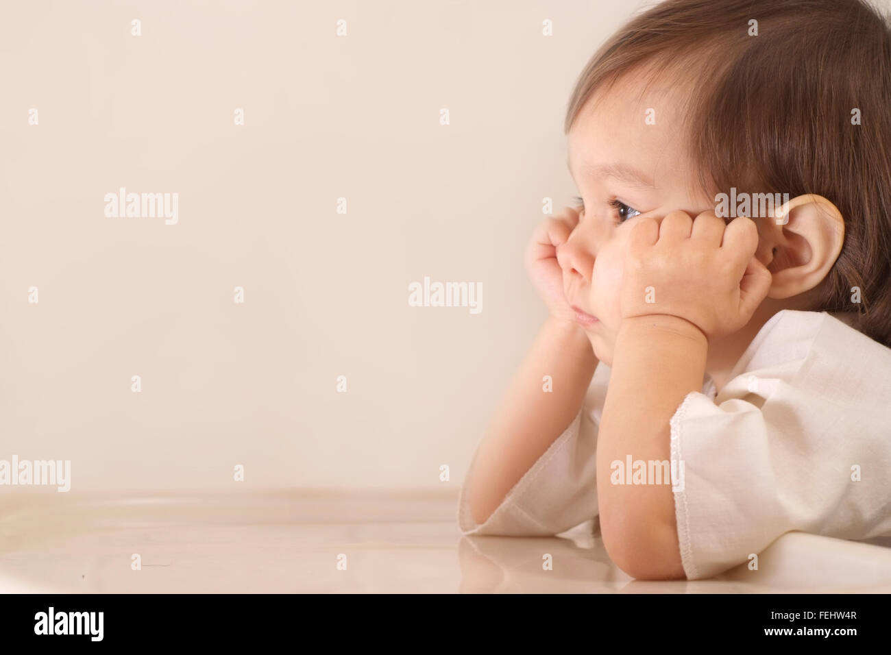 Portrait of thoughtful little girl Stock Photo - Alamy