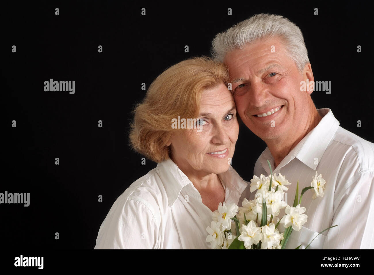Nice old people with flowers Stock Photo - Alamy