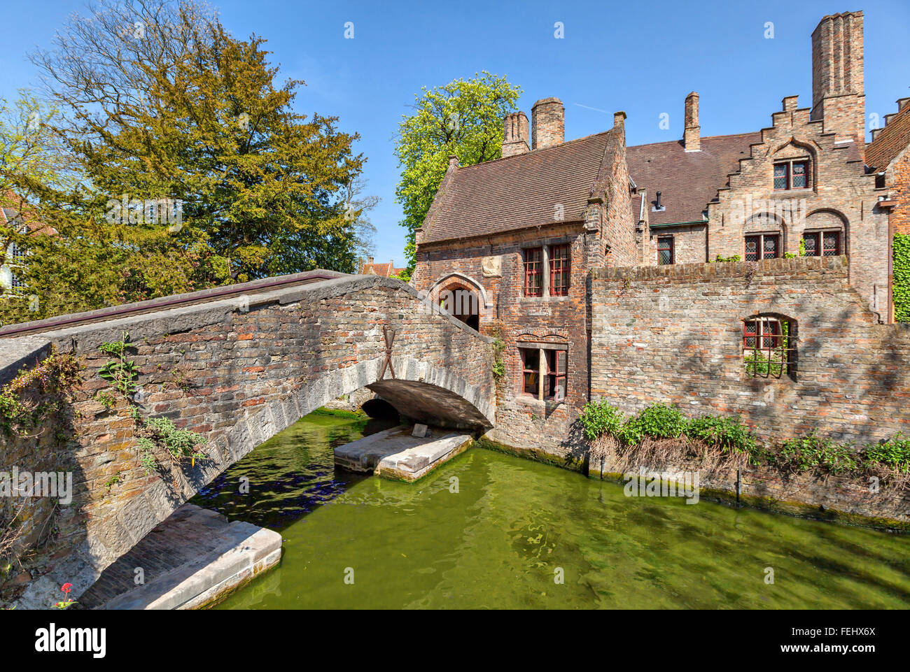 Small old bridge and flemish-style house in Bruges, Belgium Stock Photo ...