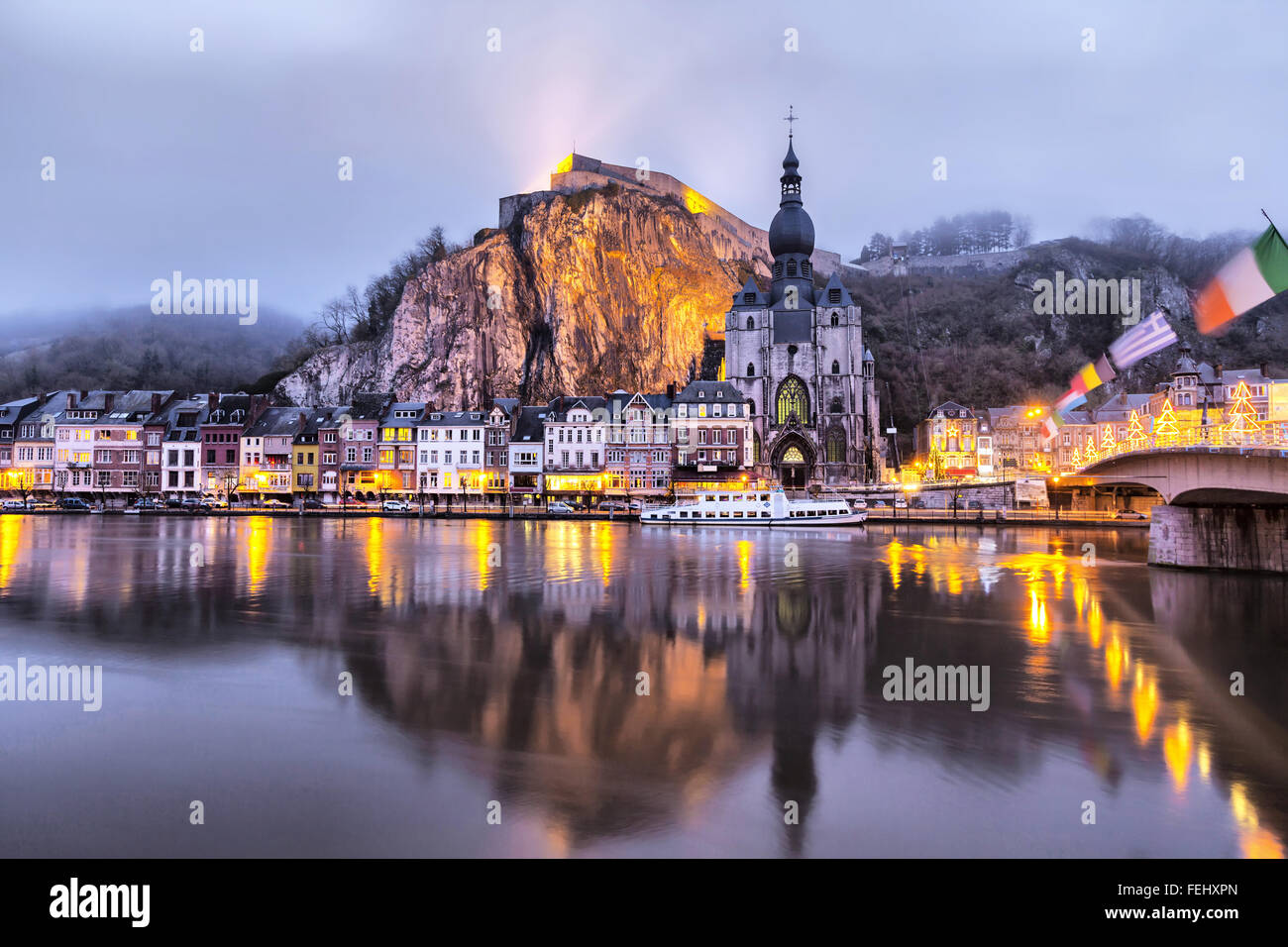 Church and Citadel reflecting in river Meuse in the foggy winter ...